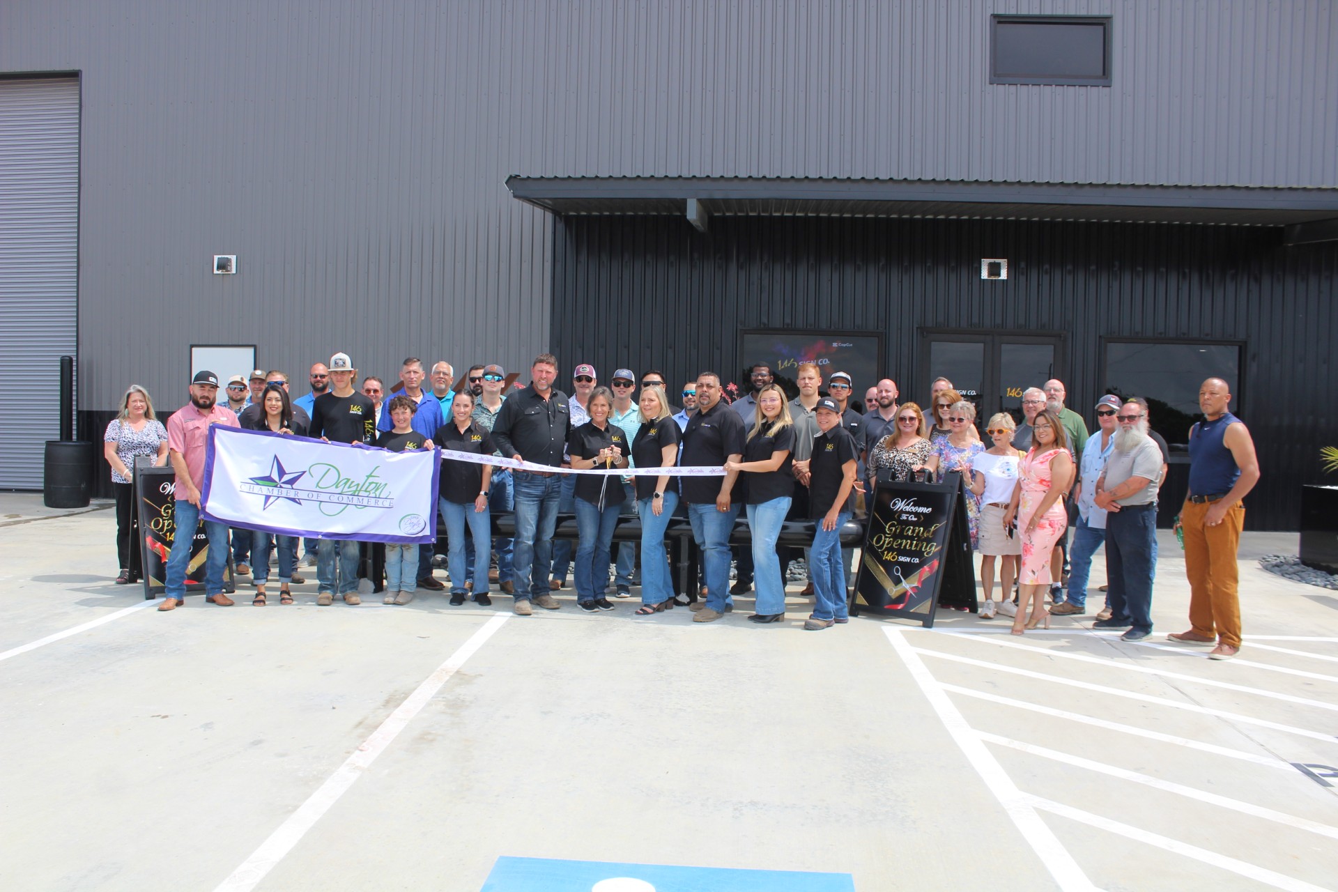 146 SIGN CO. MARKS OPENING WITH RIBBON CUTTING | Liberty Vindicator